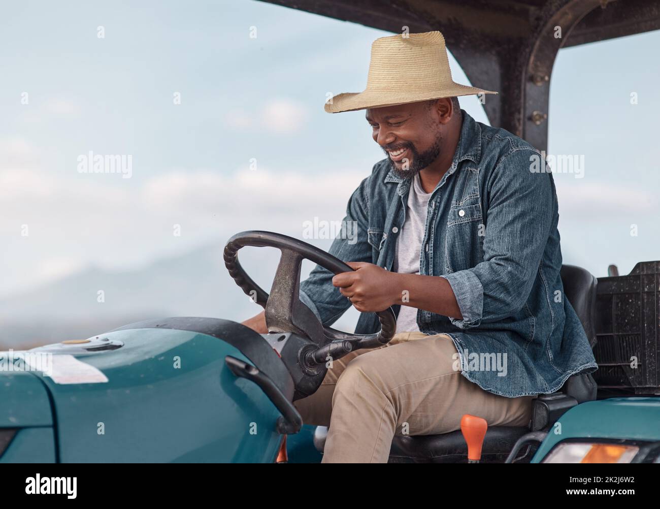 African farmer tractor smiling hi-res stock photography and images - Alamy