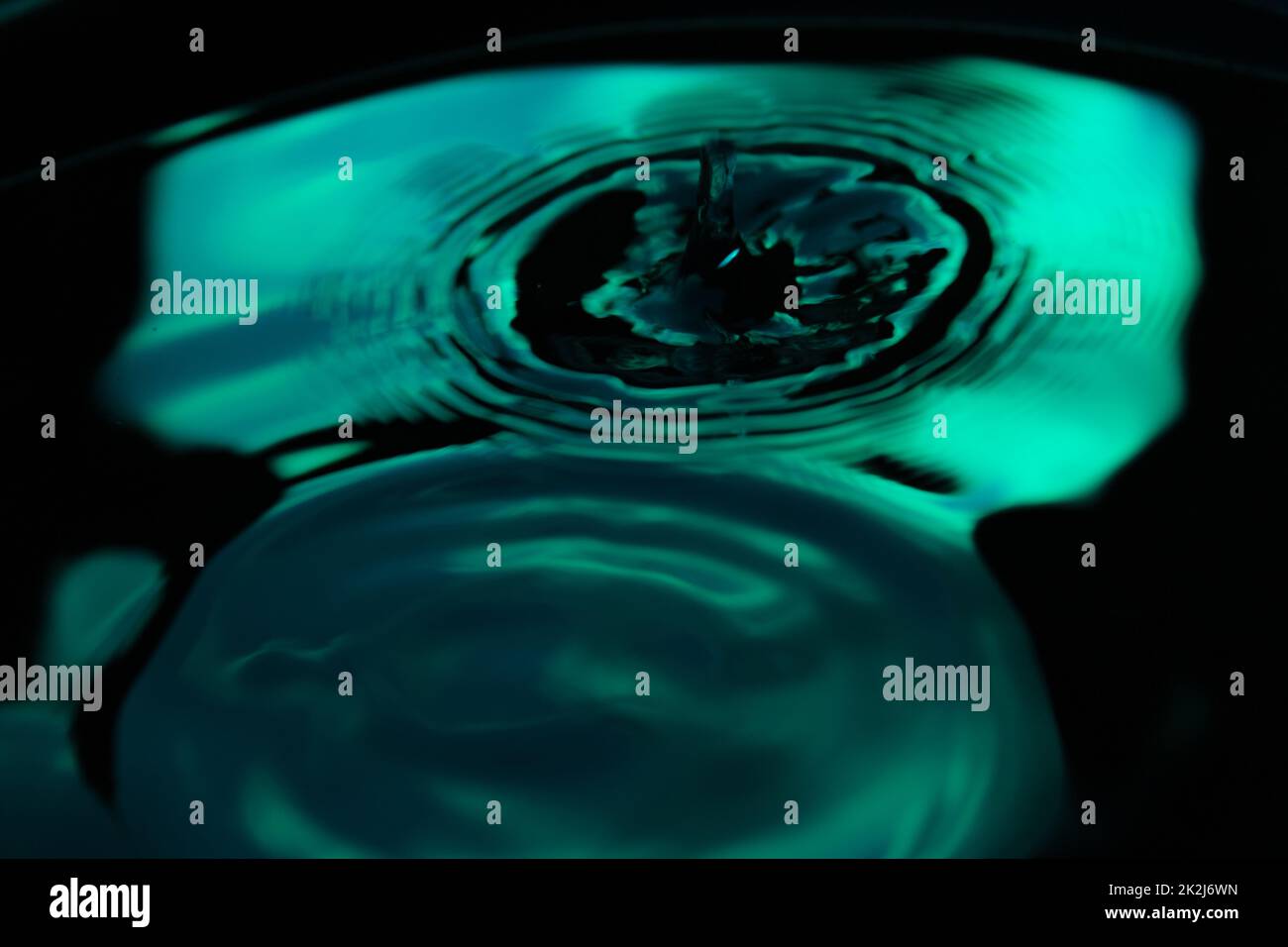 Beautiful drop of water jumping Stock Photo - Alamy