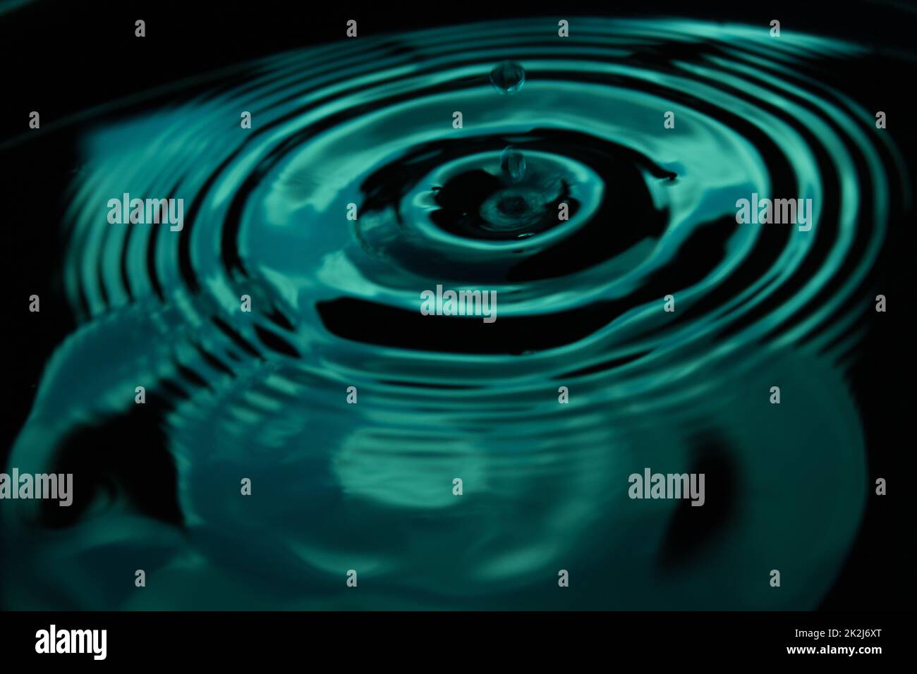 One drop of water jumping Stock Photo - Alamy