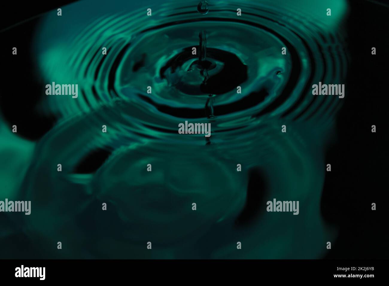 Drop of water jump hight Stock Photo - Alamy