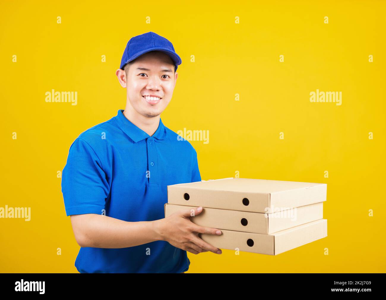 delivery service man standing he smile wearing blue t-shirt and cap ...