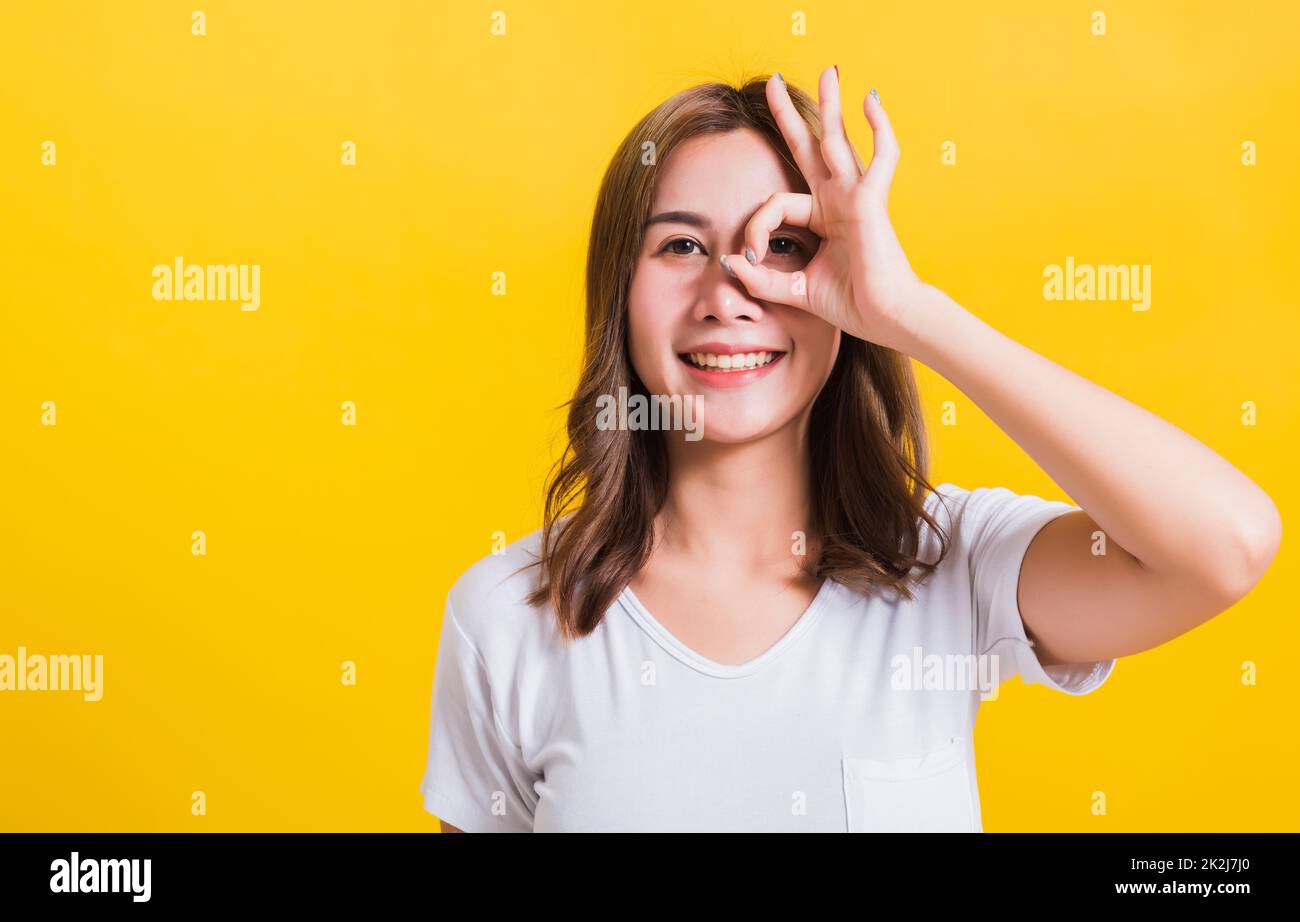 Portrait Asian beautiful young woman made finger OK symbol sign Stock Photo - Alamy