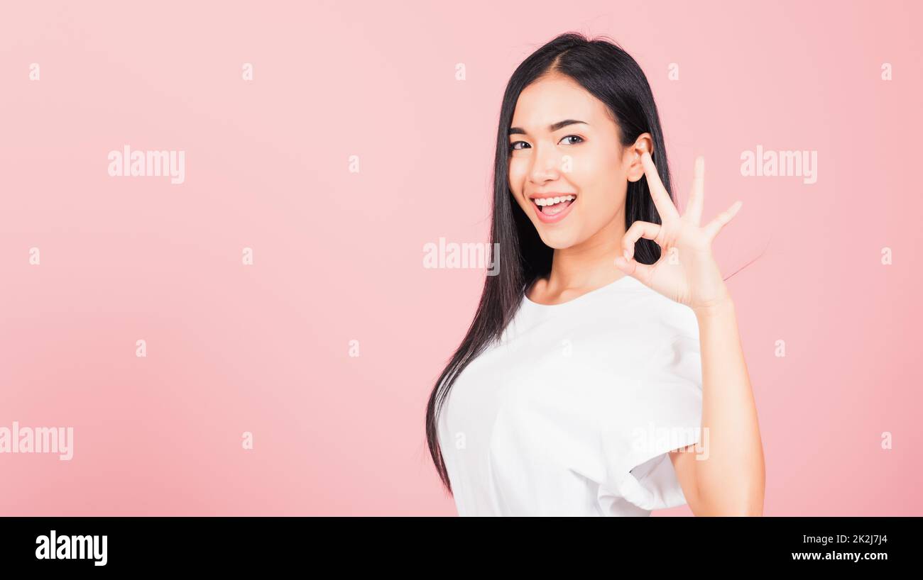 woman standing, She made finger OK symbol sign to agree side away Stock ...