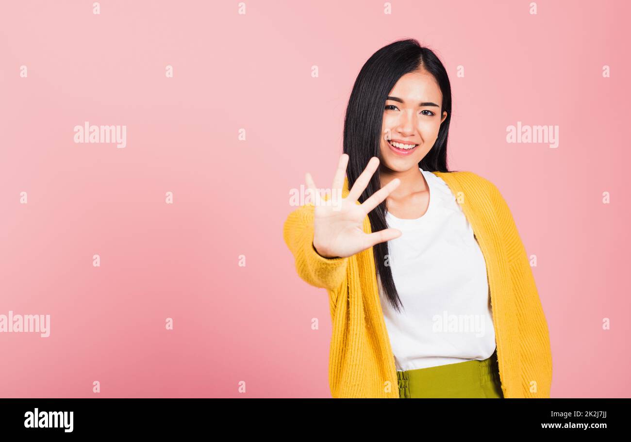 woman teen smiling doing show stop sign gesture with palm Stock Photo ...