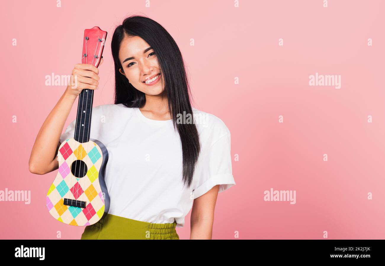 woman teen confident smiling face hold acoustic Ukulele guitar Stock ...