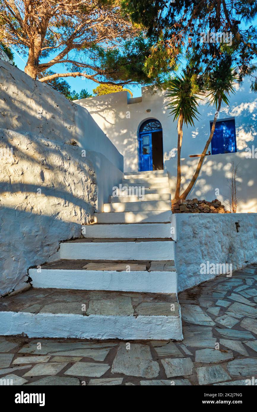 Greek village typical view with whitewashed houses and stairs. Plaka ...