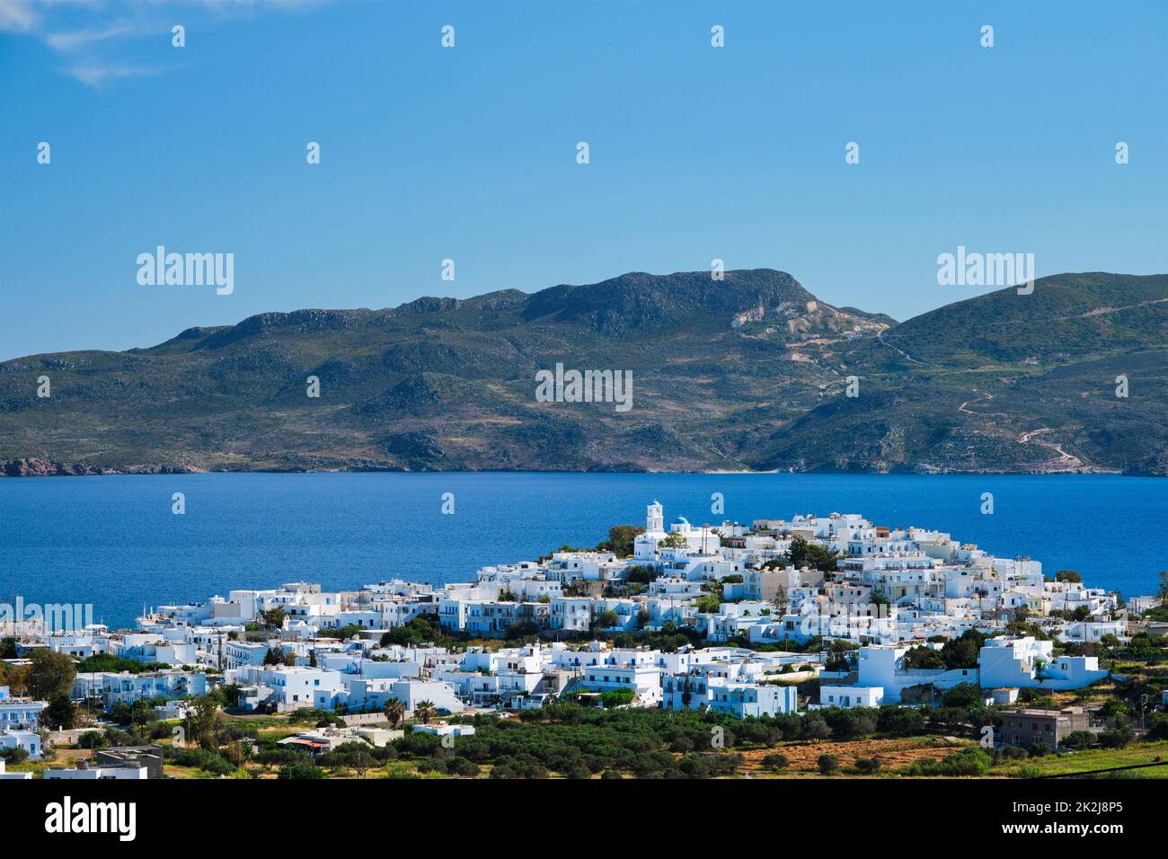 View of Plaka village with traditional Greek church. Milos island ...