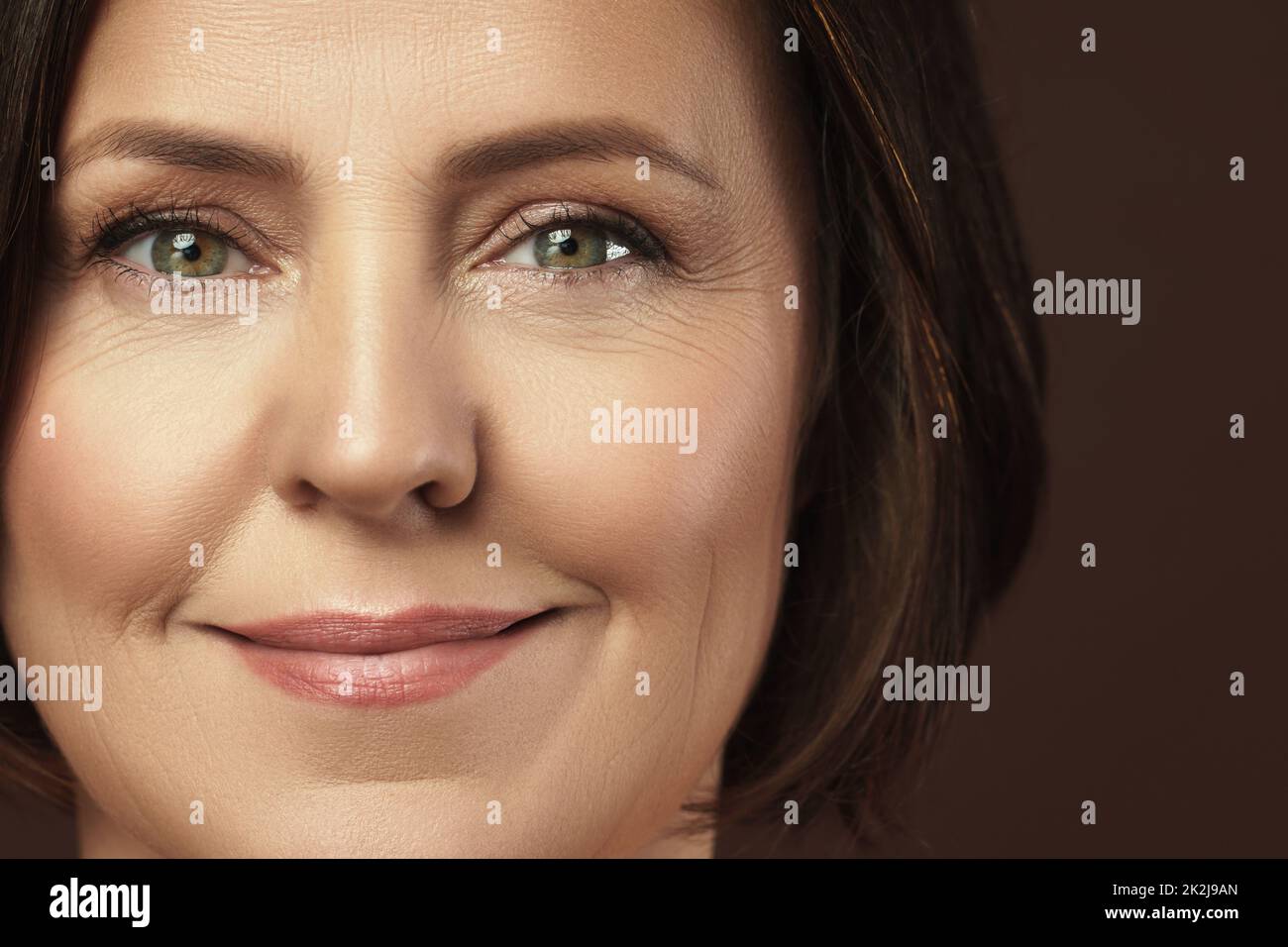 Beautiful middle aged woman with clean wrinkled skin Stock Photo - Alamy