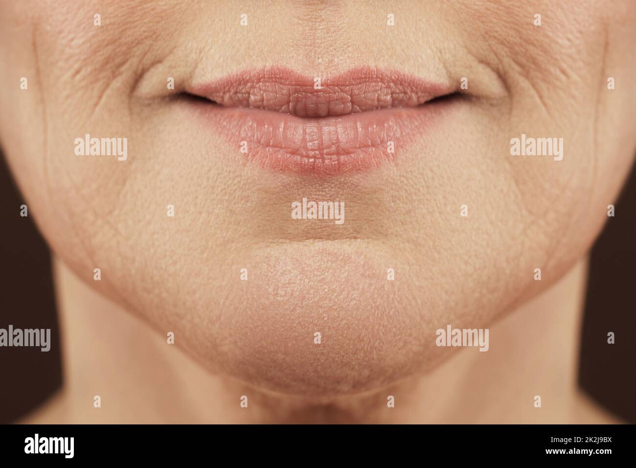 Aged female lips with expression lines Stock Photo - Alamy