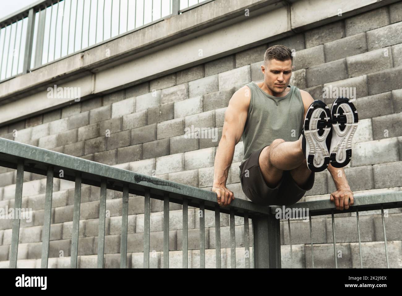 Man athlete doing L-sit exercise during his calisthenics workout Stock ...