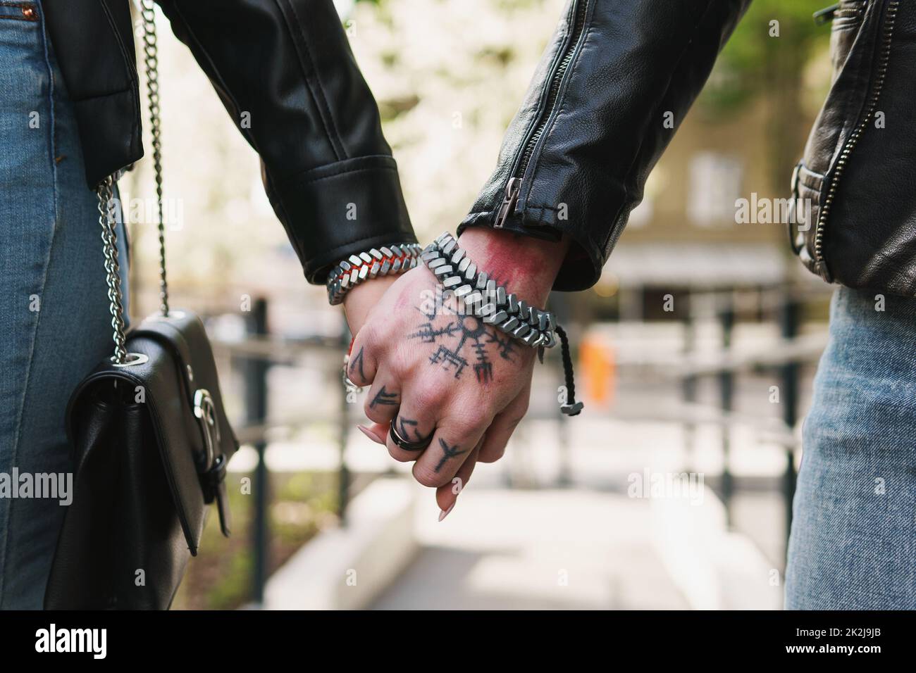 Young loving couple holding hands during a date outdoors Stock Photo ...