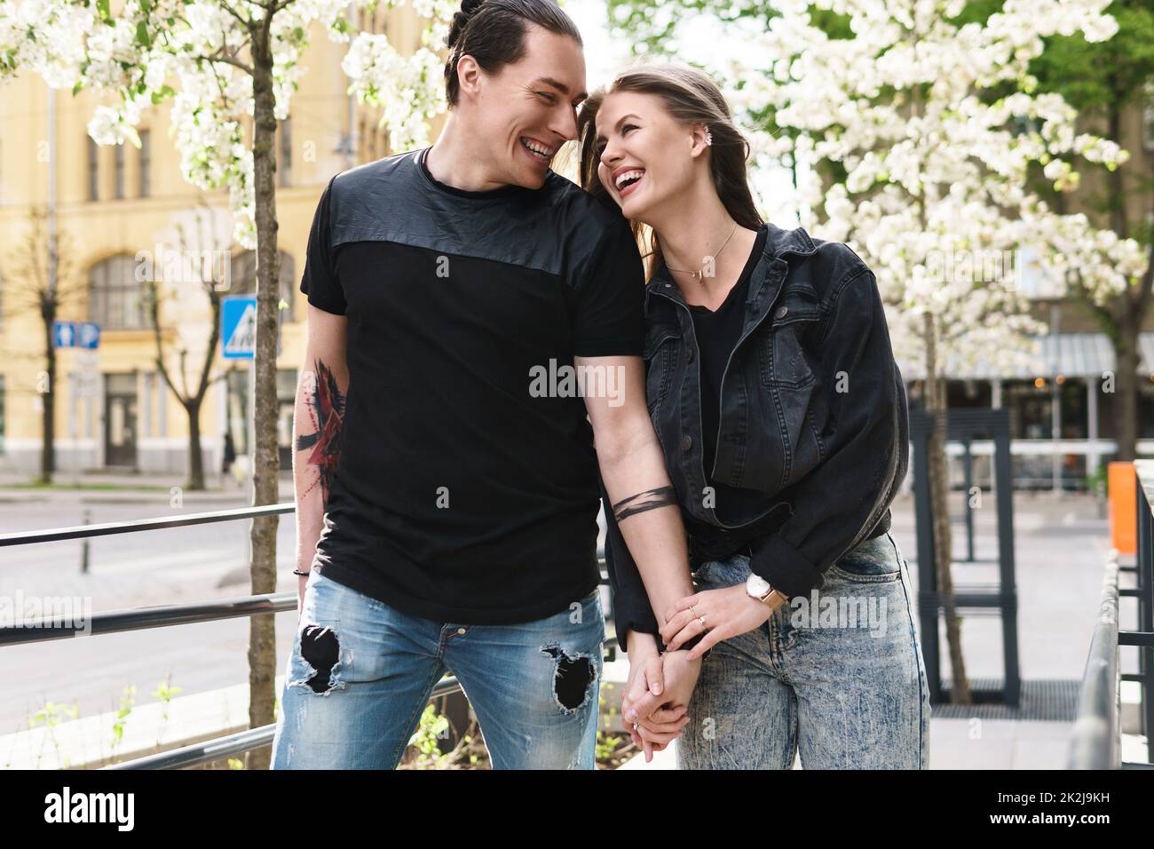 Happy laughing couple having fun during their date on a city str Stock ...