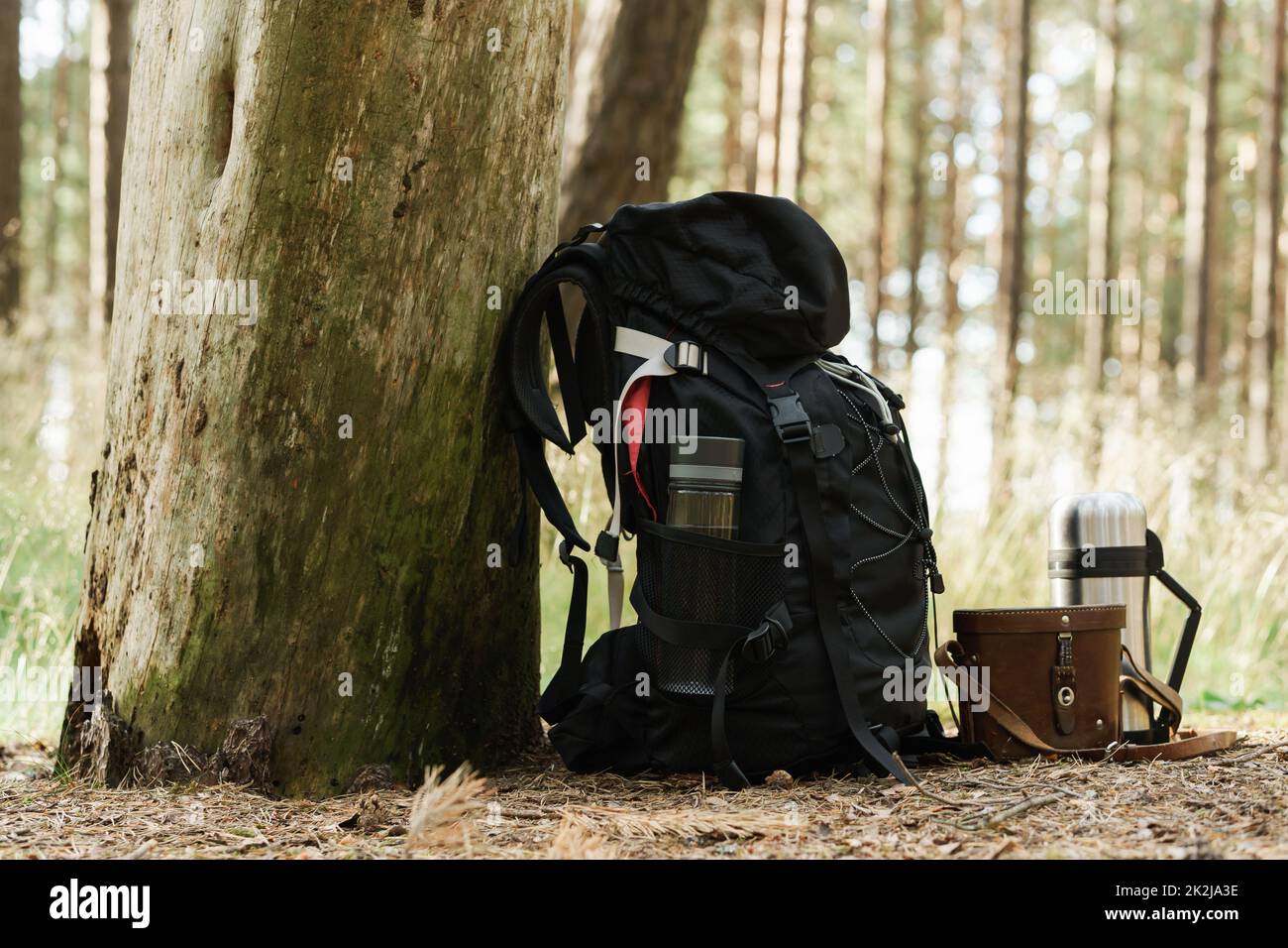 Traveler's backpack with supplies on the ground Stock Photo - Alamy