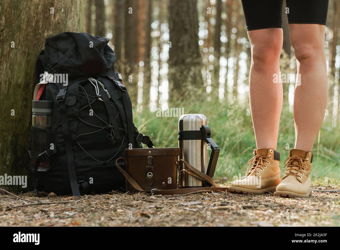 Female legs and hiker's backpack on the ground Stock Photo - Alamy