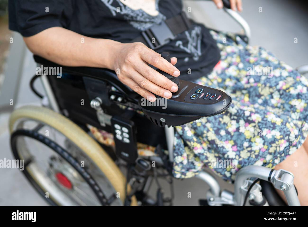 Asian lady woman patient on electric wheelchair with joystick at ...