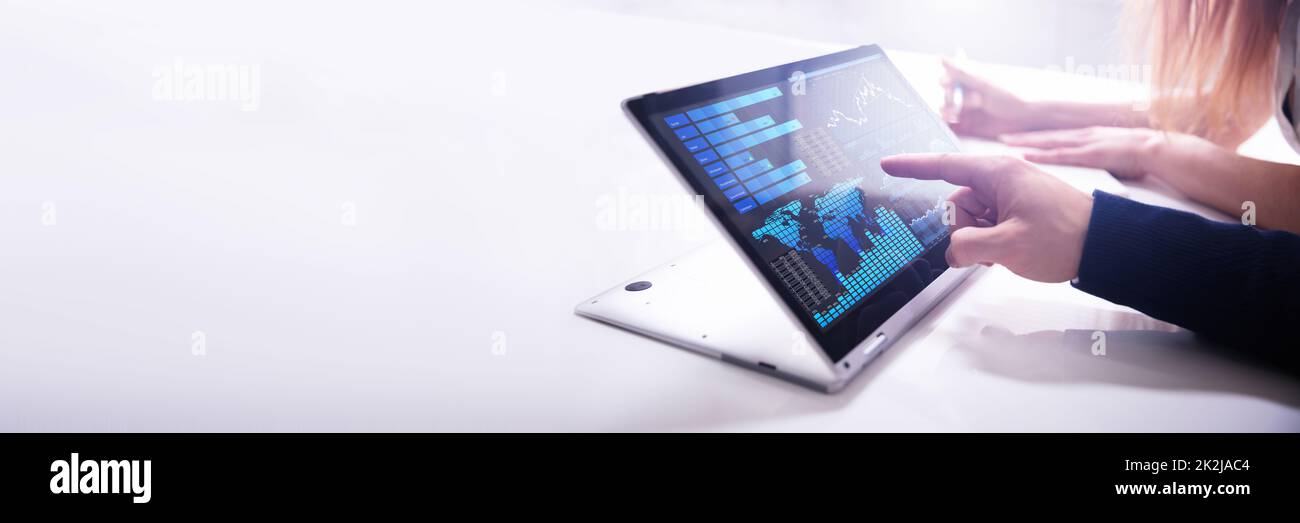 Businessman's Hand Pointing Bar Graph On Laptop Stock Photo - Alamy