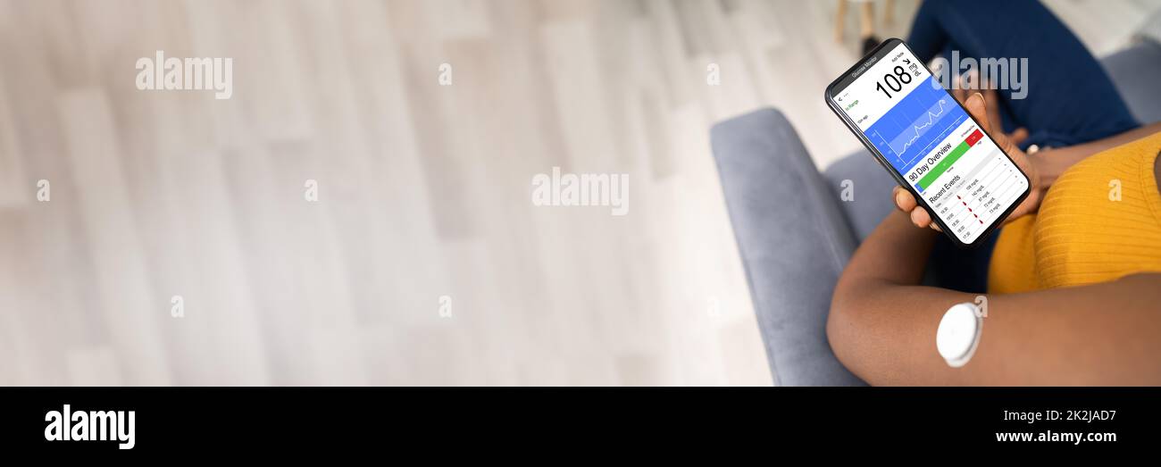 Continuous Glucose Monitor Blood Sugar App Stock Photo - Alamy