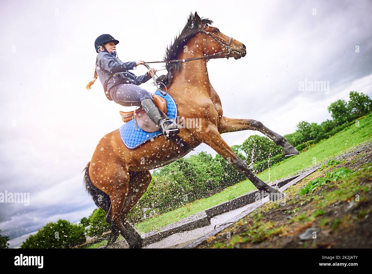 Practice clearly made perfect. Shot of a teenage girl going horseback ...
