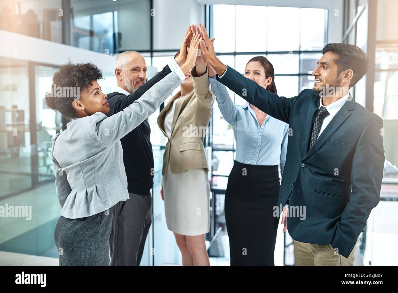 Motivating each other to move mountains. Shot of a group of ...