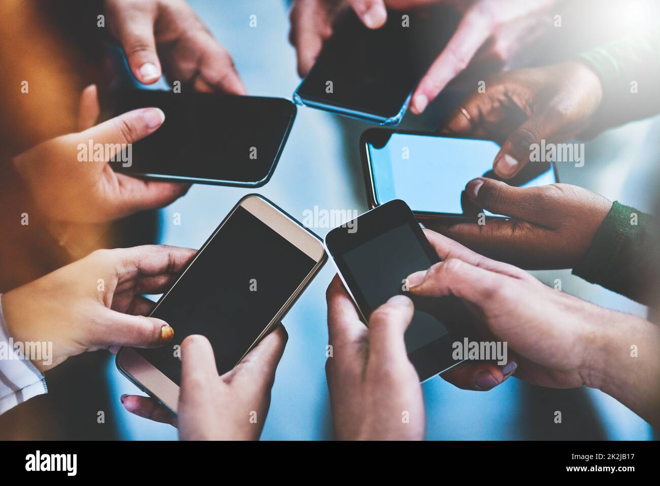 Hands with phones in hi-res stock photography and images - Alamy