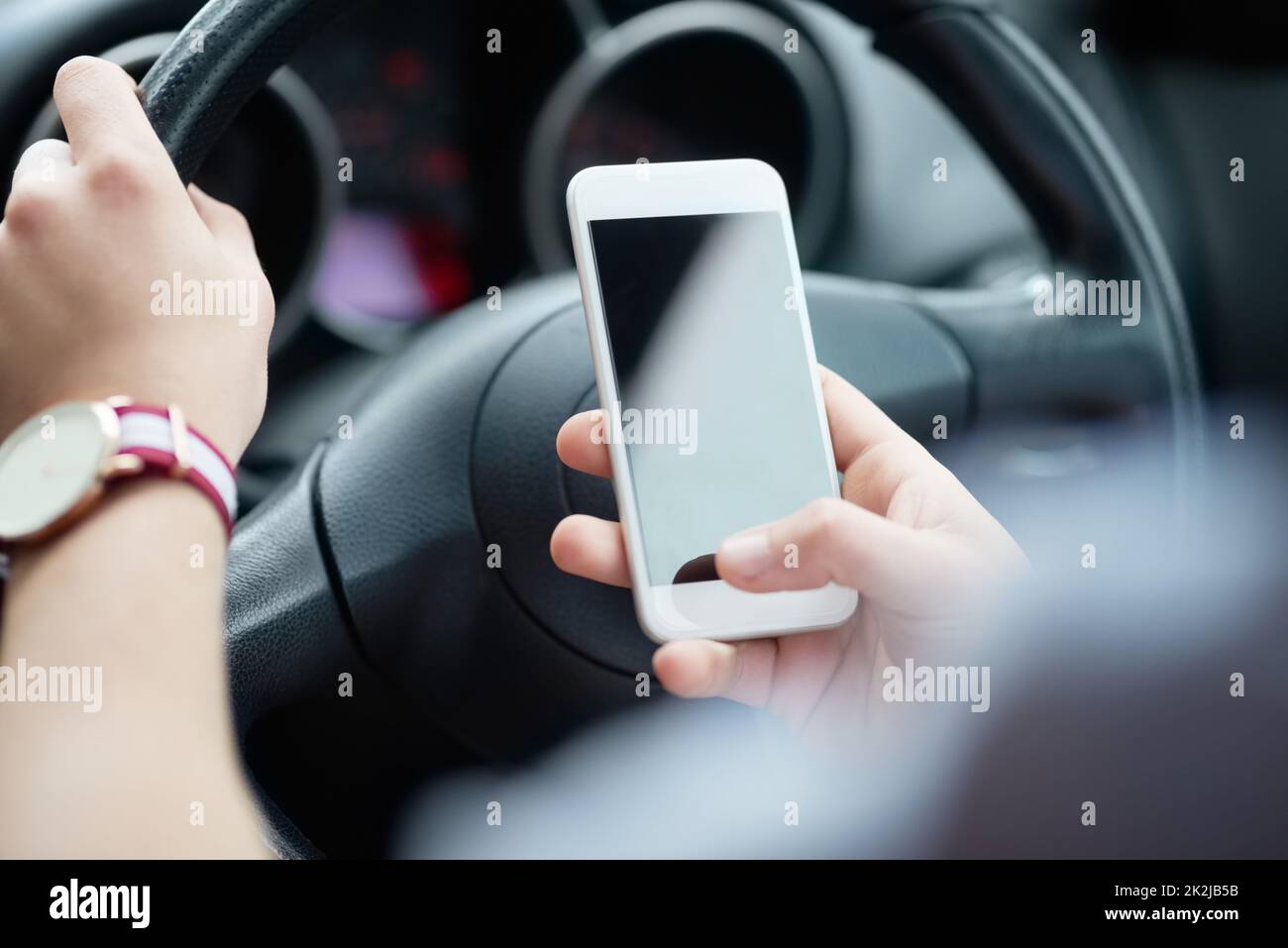 Keep your eyes on the road and avoid distracted driving. Closeup shot ...