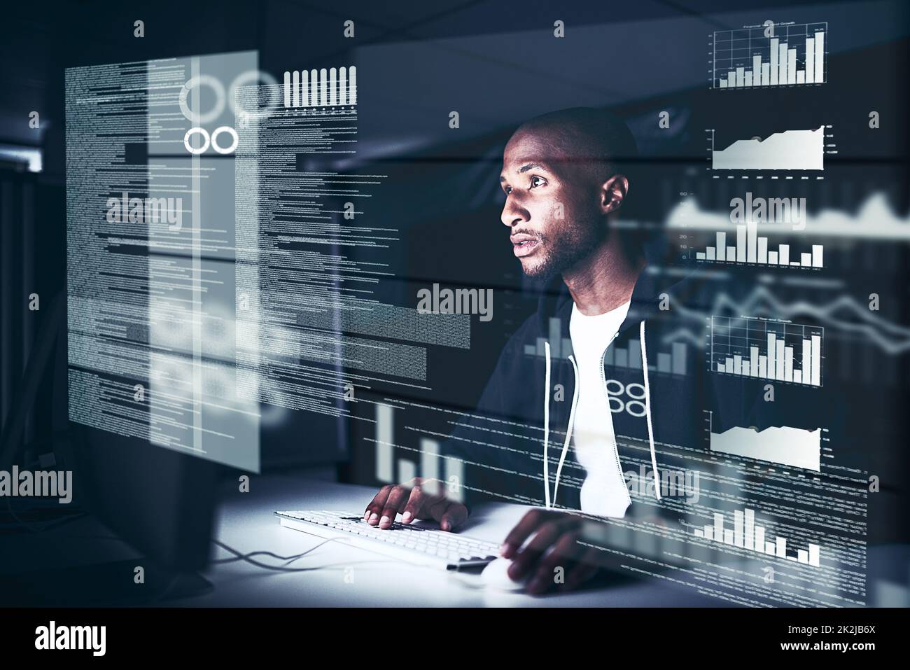 Fixing a bug. Cropped shot of a young male hacker cracking a computer ...