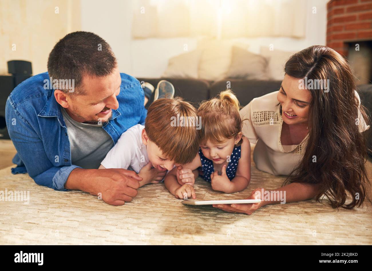 Family using tech hi-res stock photography and images - Alamy