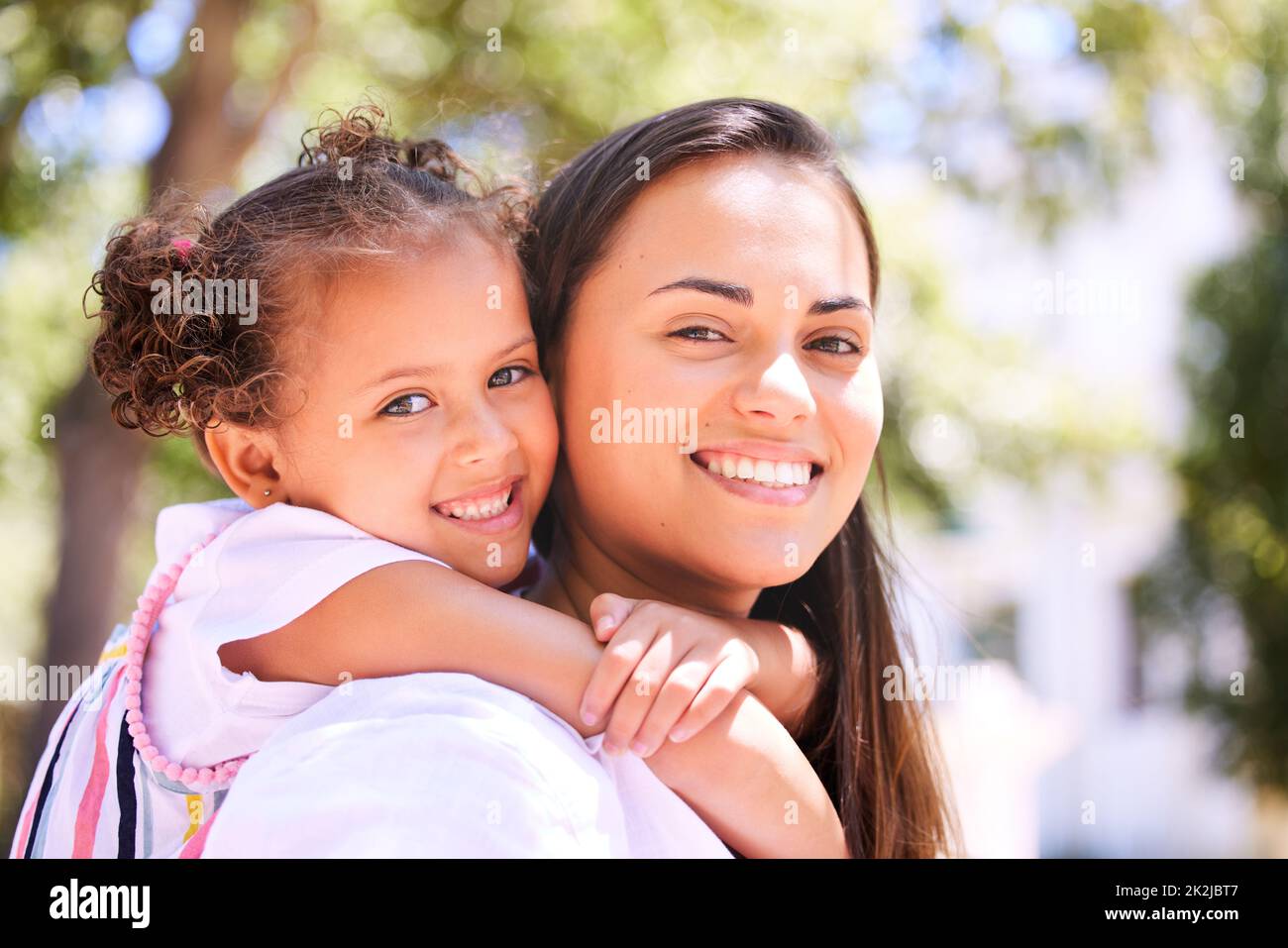 Mother giving daughter a piggyback hi-res stock photography and images ...