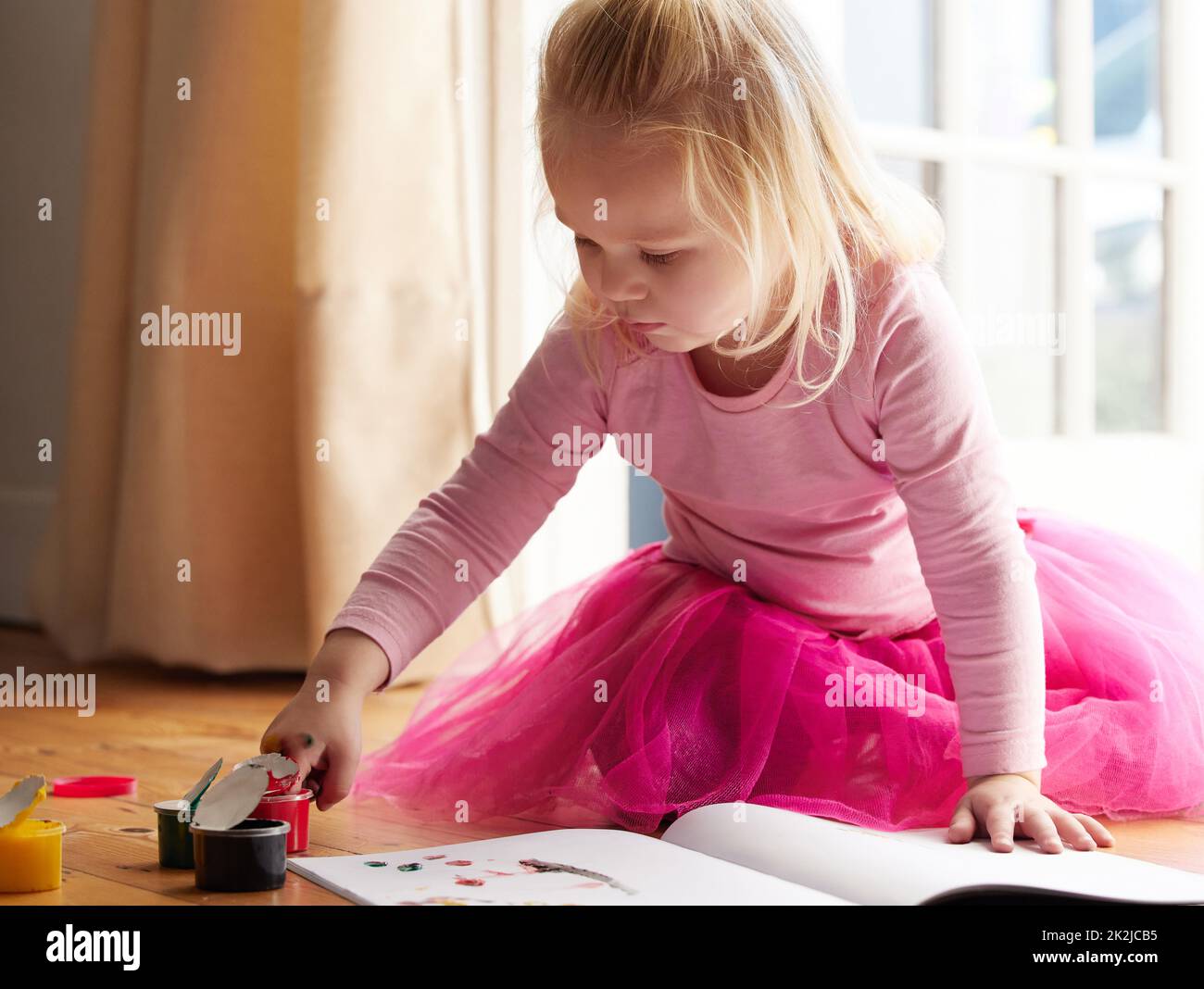 I like all things pink and colourful. Shot of a little girl doing a ...
