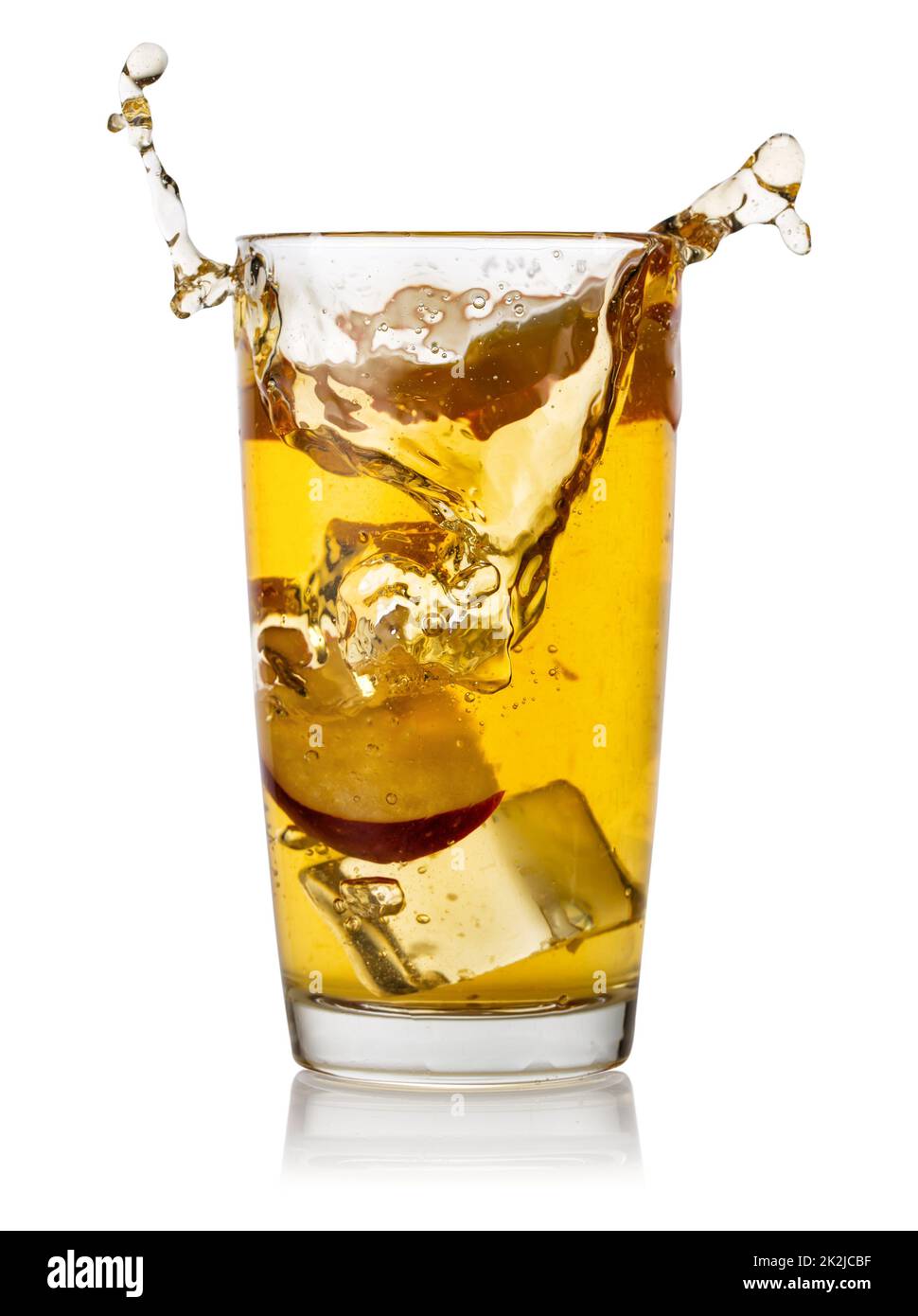 Splash of ice and apple slices in a glass of apple juice Stock Photo ...