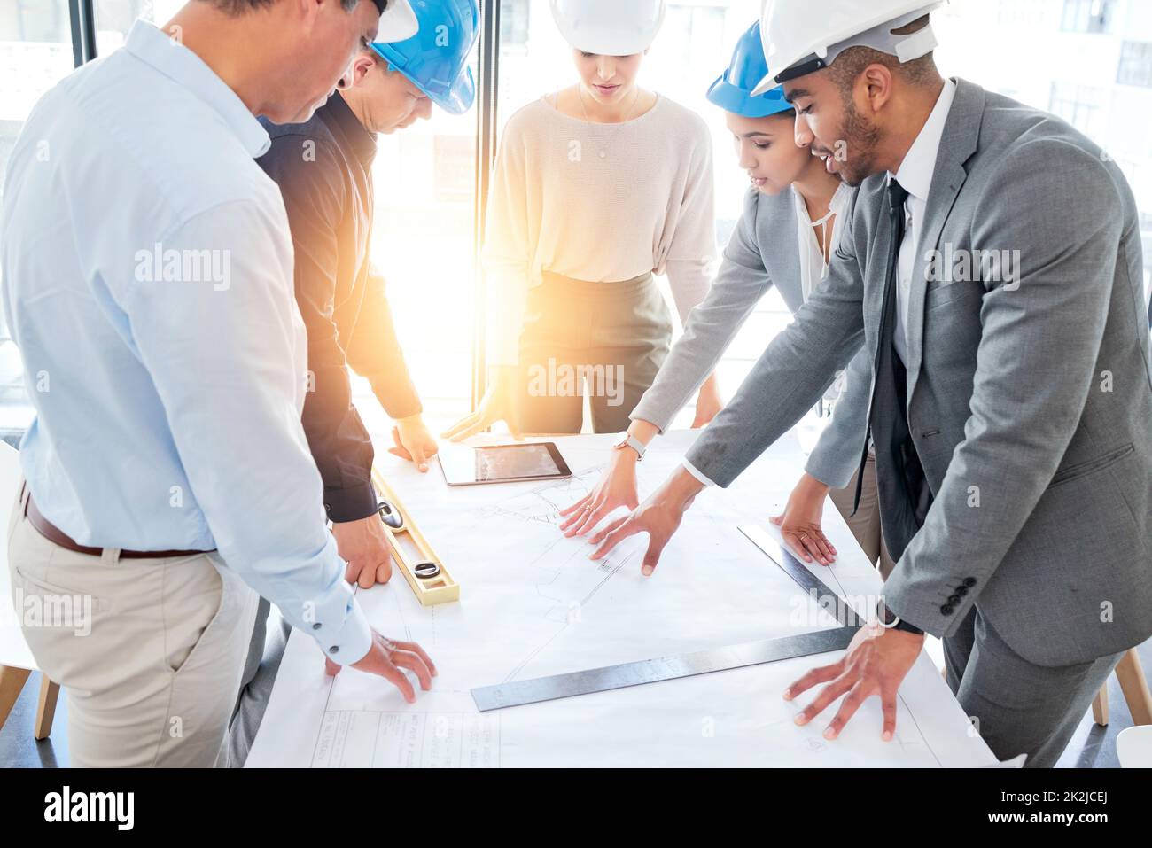 Shot Of A Group Of Businesspeople Having A Meeting In An Office At Work