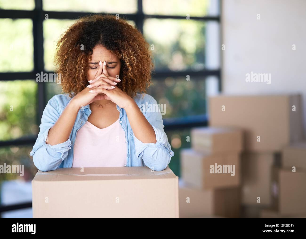 Another victim of the debt trap. Shot of a young woman looking worried ... Another victim of the debt trap. Shot of a young woman looking worried ...