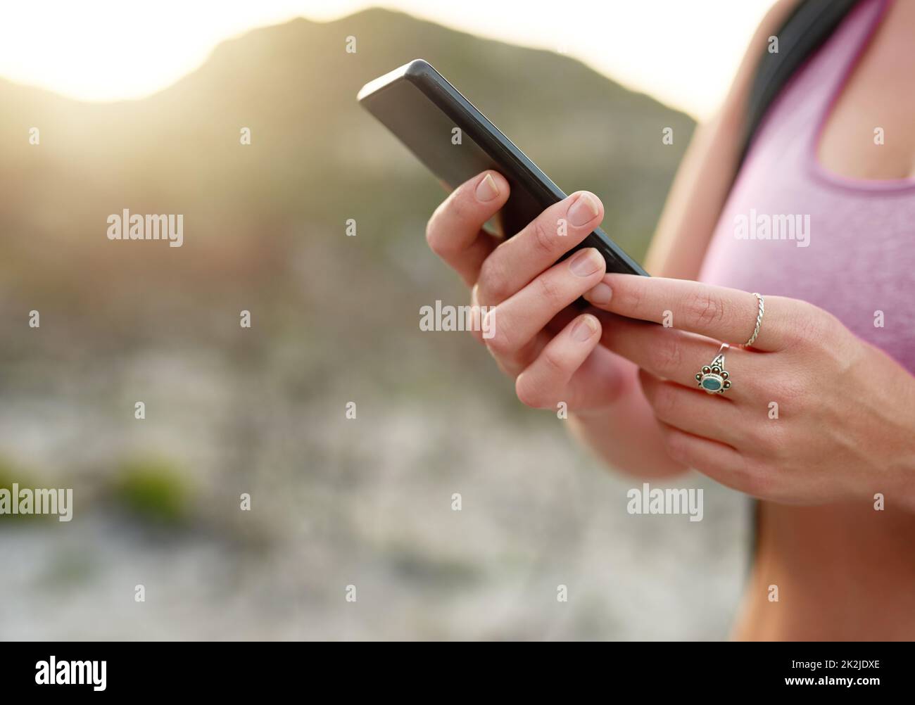 Using her phones GPS to plan her hiking route. Closeup shot of an ...