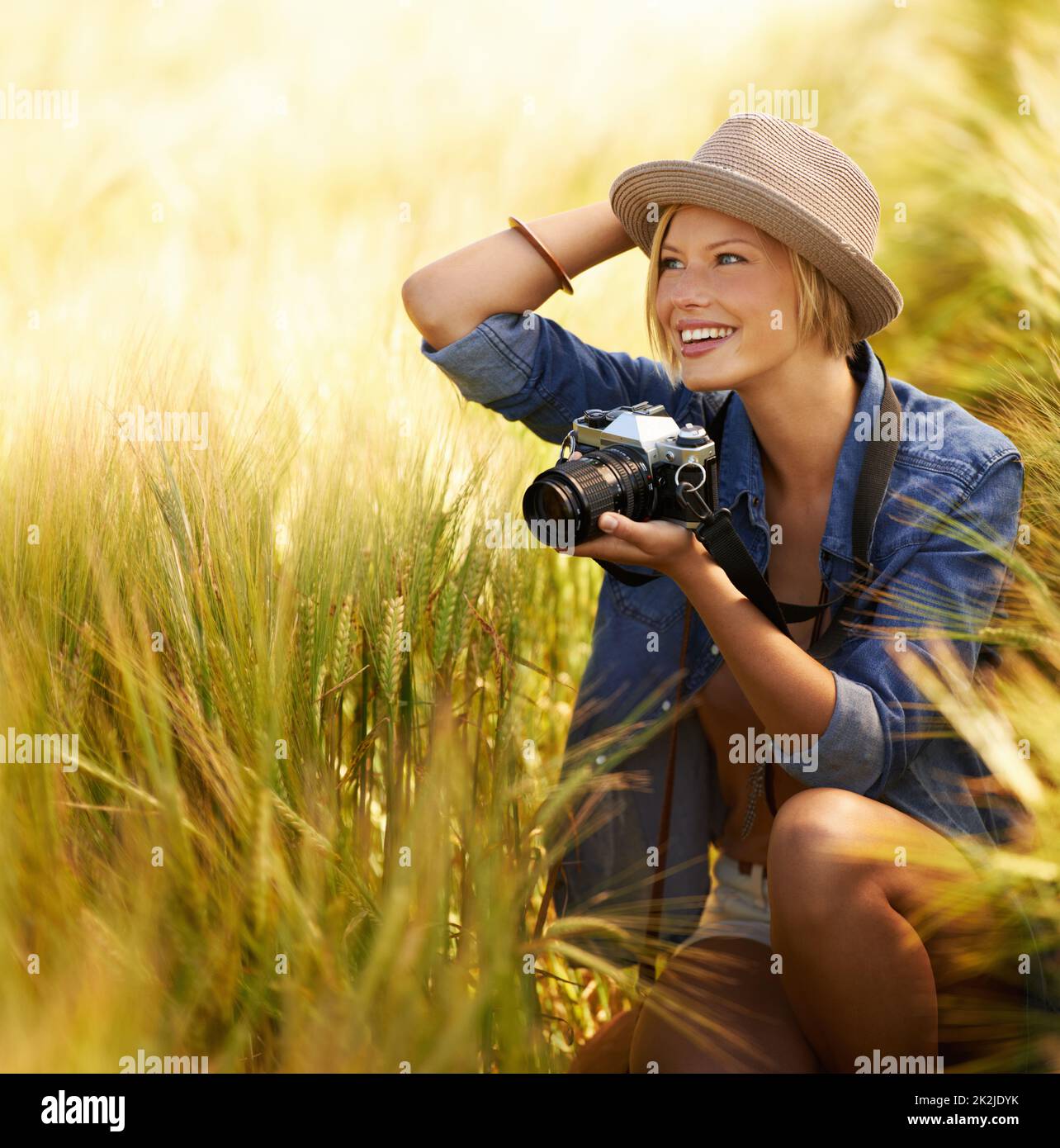 Fascinated by nature. an attractive young woman outdoors on a summer ...
