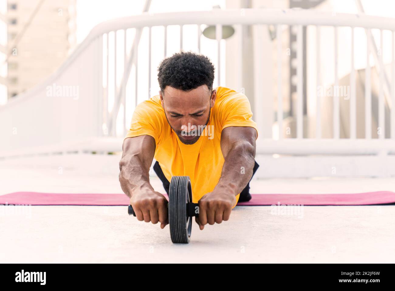 Black hispanic sportsman training outdoors in the city - African man ...