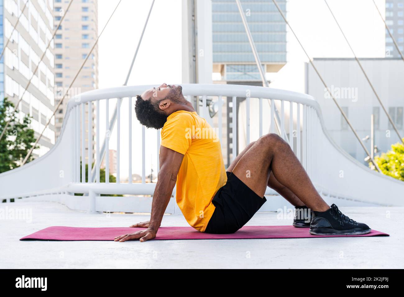 Black hispanic sportsman training outdoors in the city - African man ...