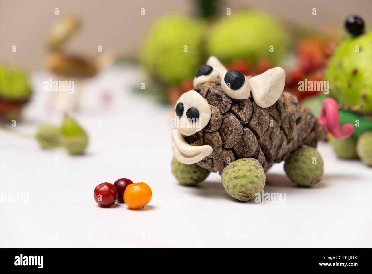 Pig figurine made of cone and plasticine, children's crafts Stock Photo ...