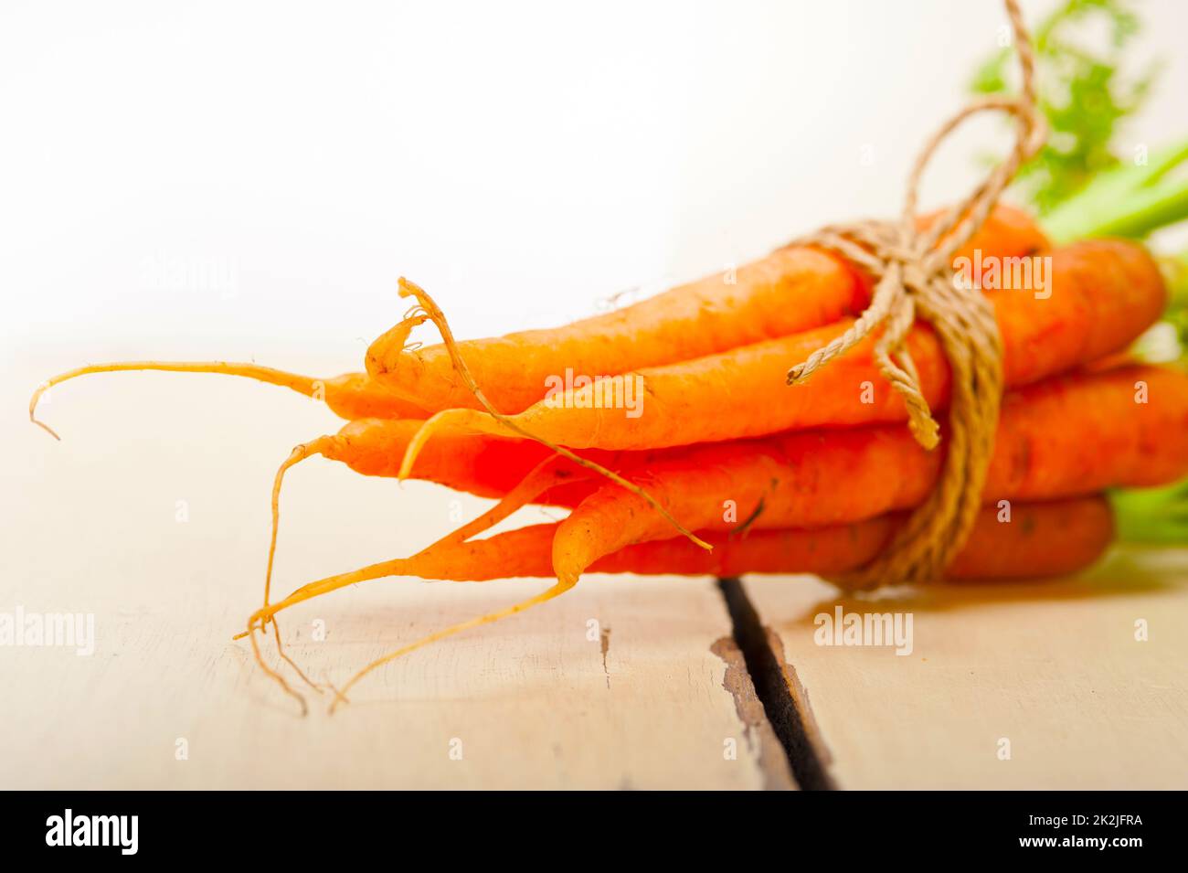 baby carrots bunch tied with rope Stock Photo - Alamy