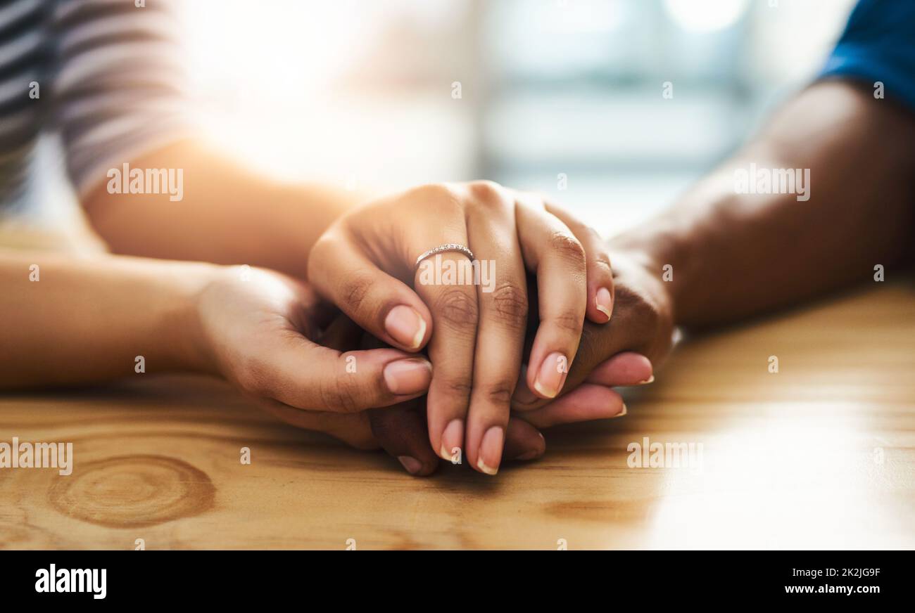 Sad couple holding hands hi-res stock photography and images - Alamy