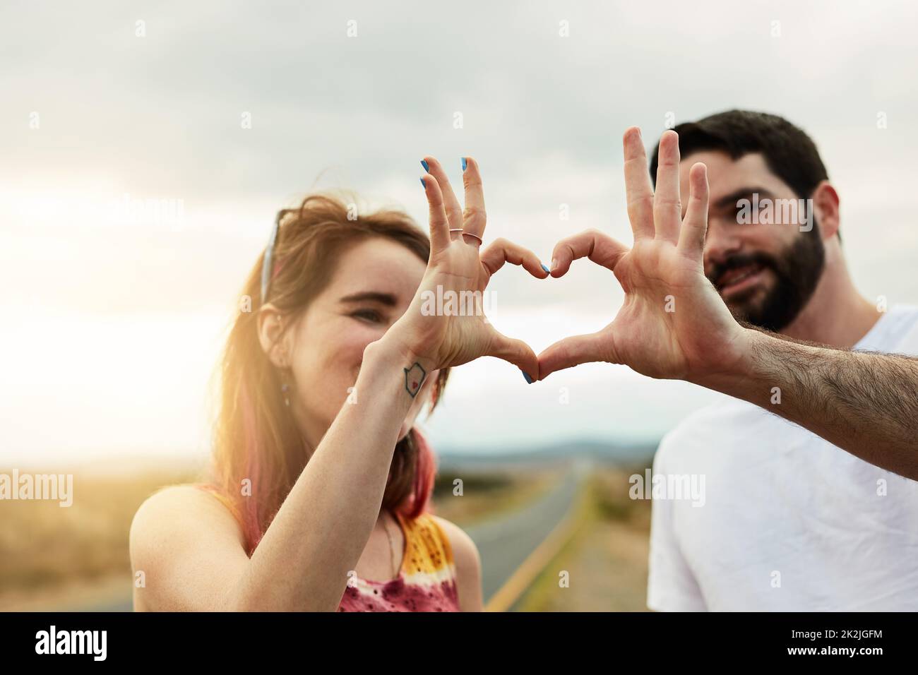 Friends forever. Shot of two young friends putting their hands together ...