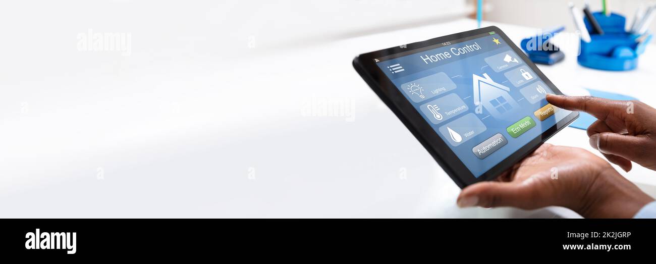 Using tablet control smart home hi-res stock photography and images - Alamy