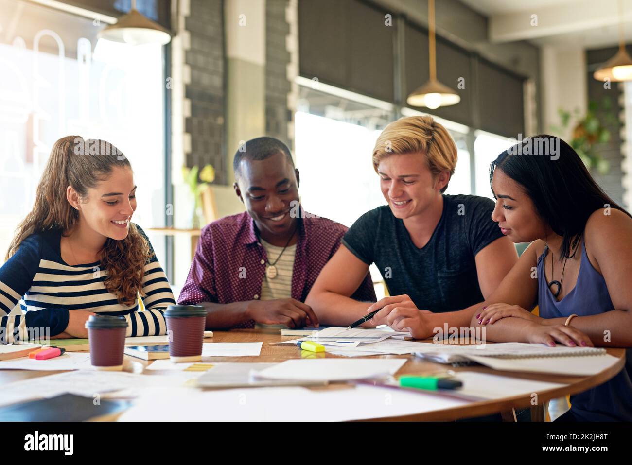 Getting ready to ace that test. Shot of a group of young friends having ...