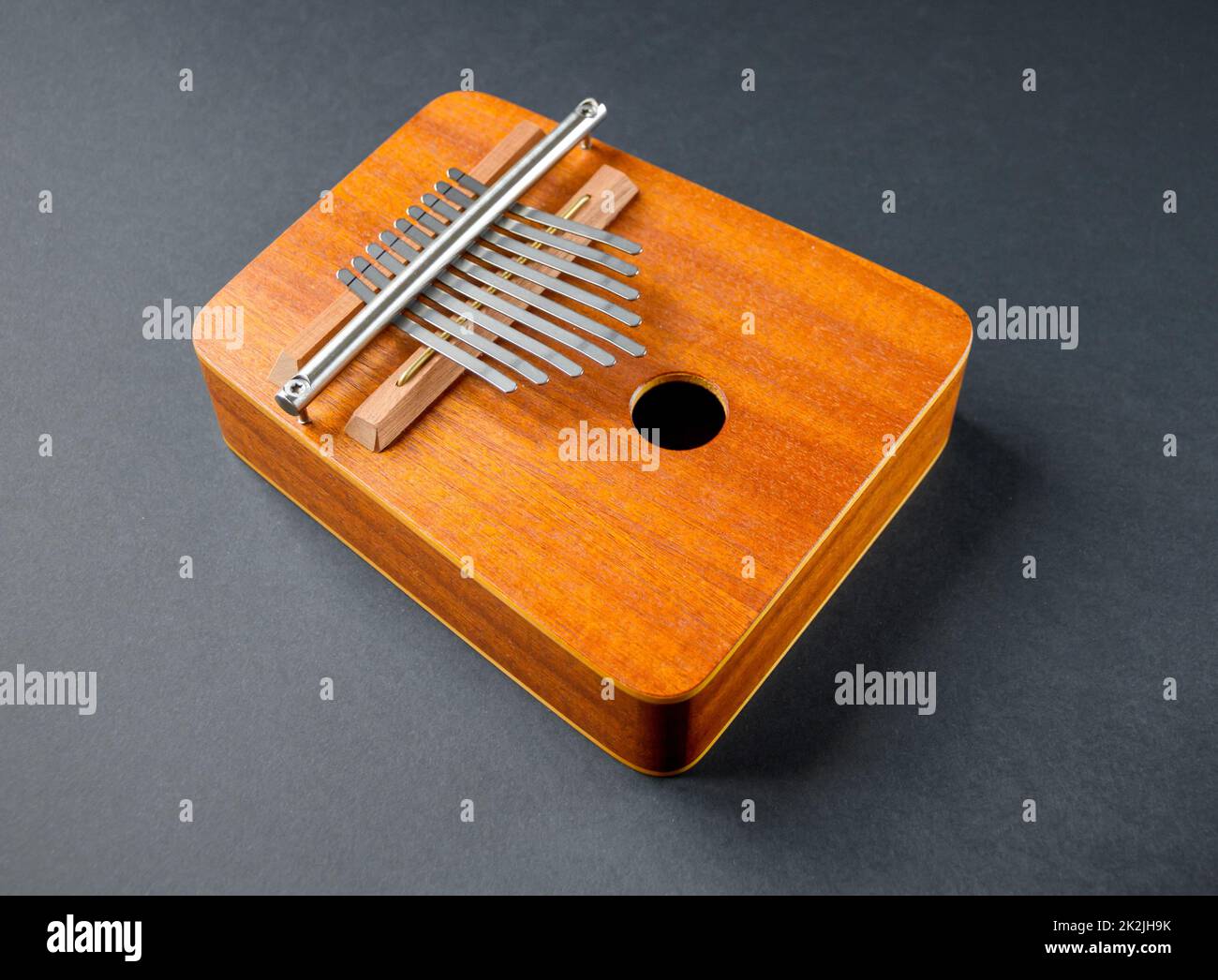 Traditional wooden kalimba isolated on black Stock Photo - Alamy
