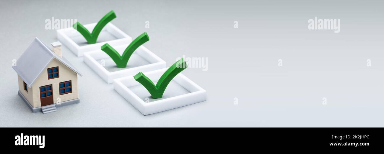 Tick Sign Near The House Model Stock Photo - Alamy