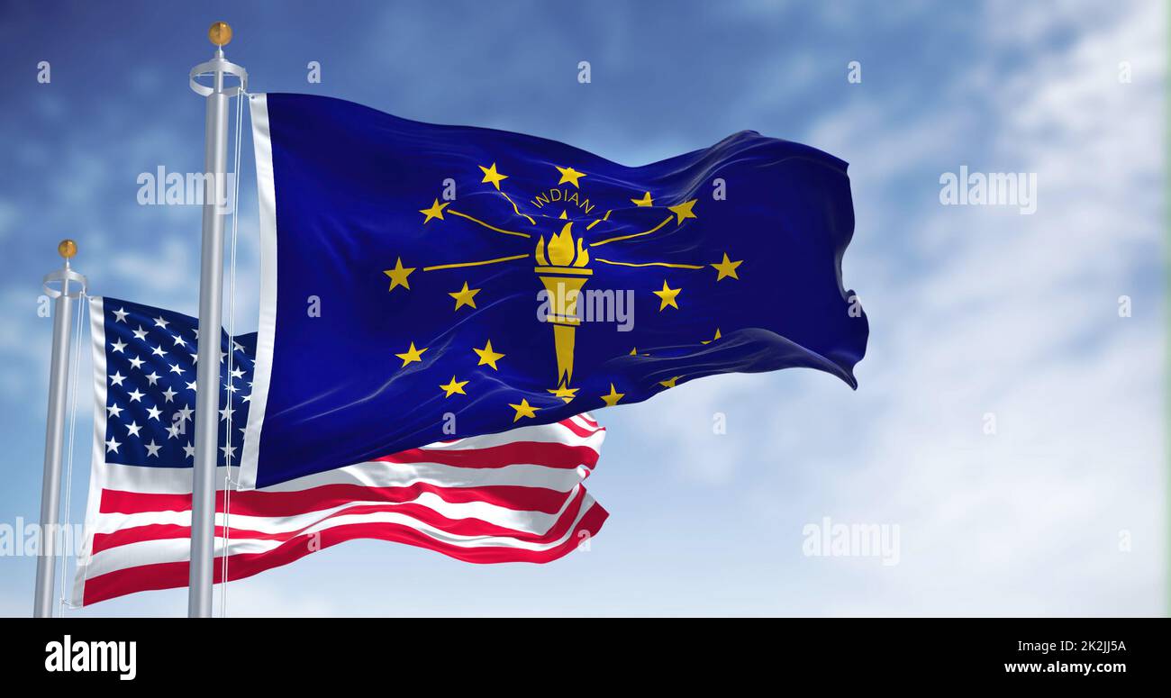 The Indiana state flag waving along with the national flag of the ...