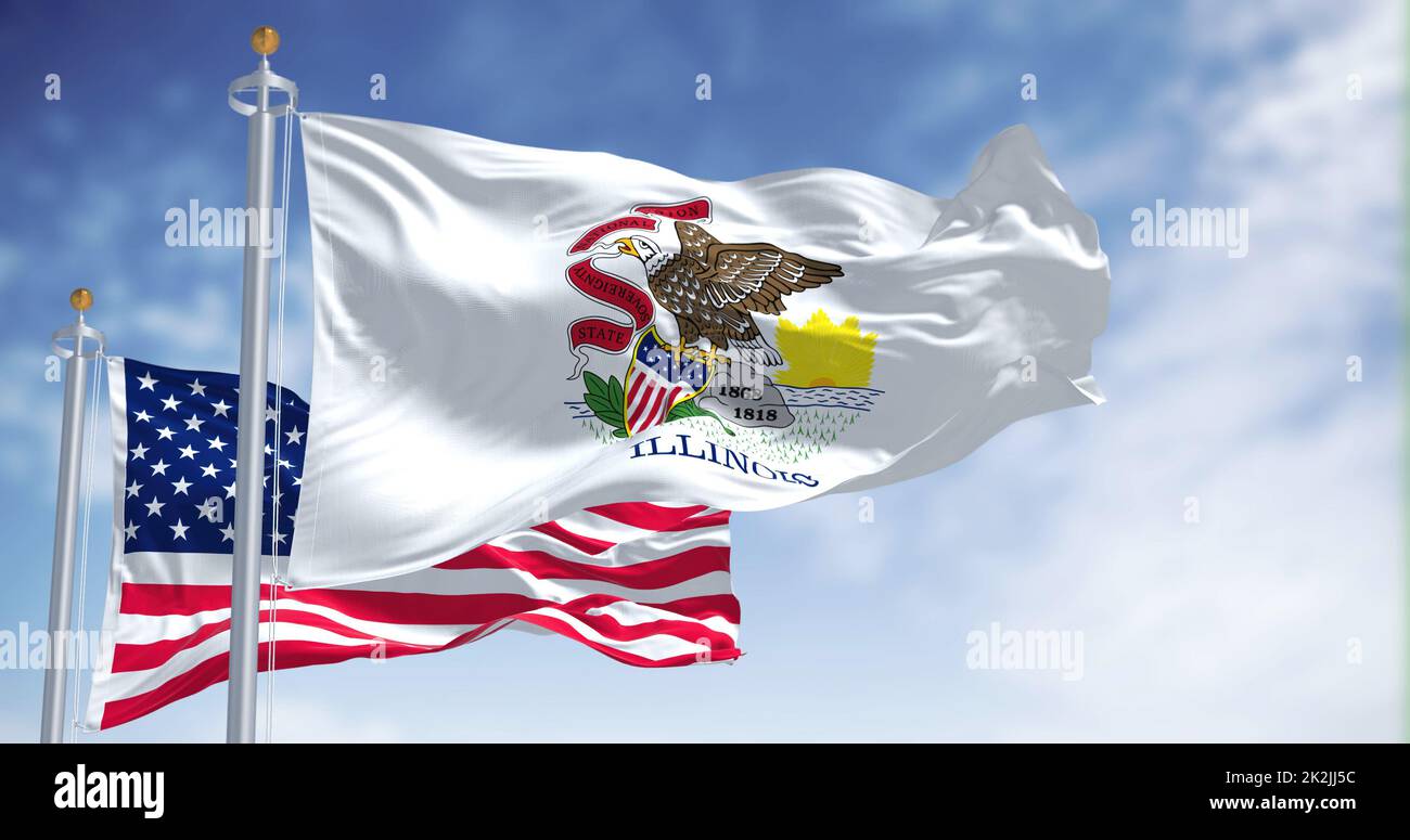 The Illinois state flag waving along with the national flag of the ...