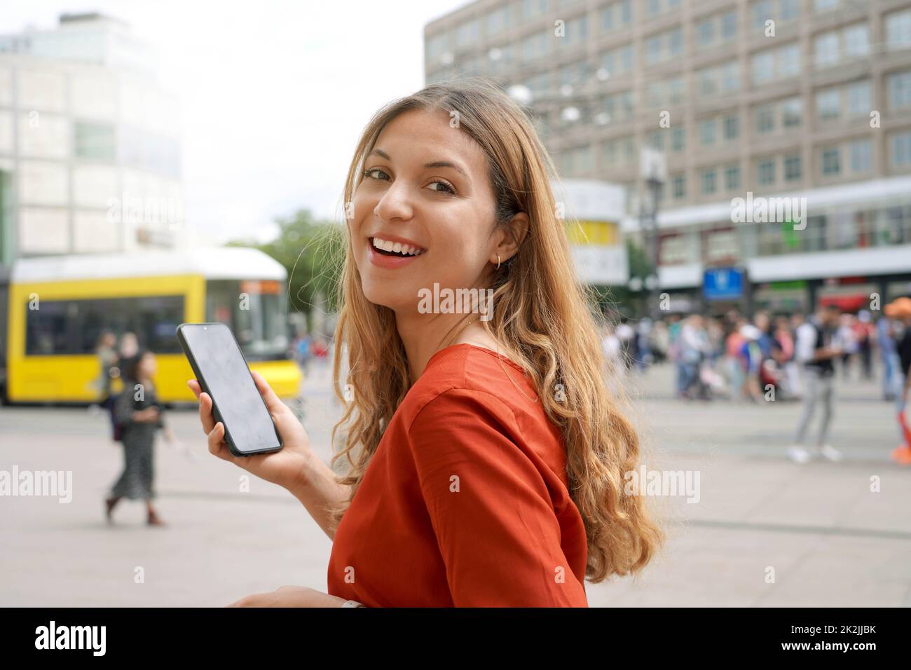 Portrait of natural beautiful smiling woman walking in Berlin ...