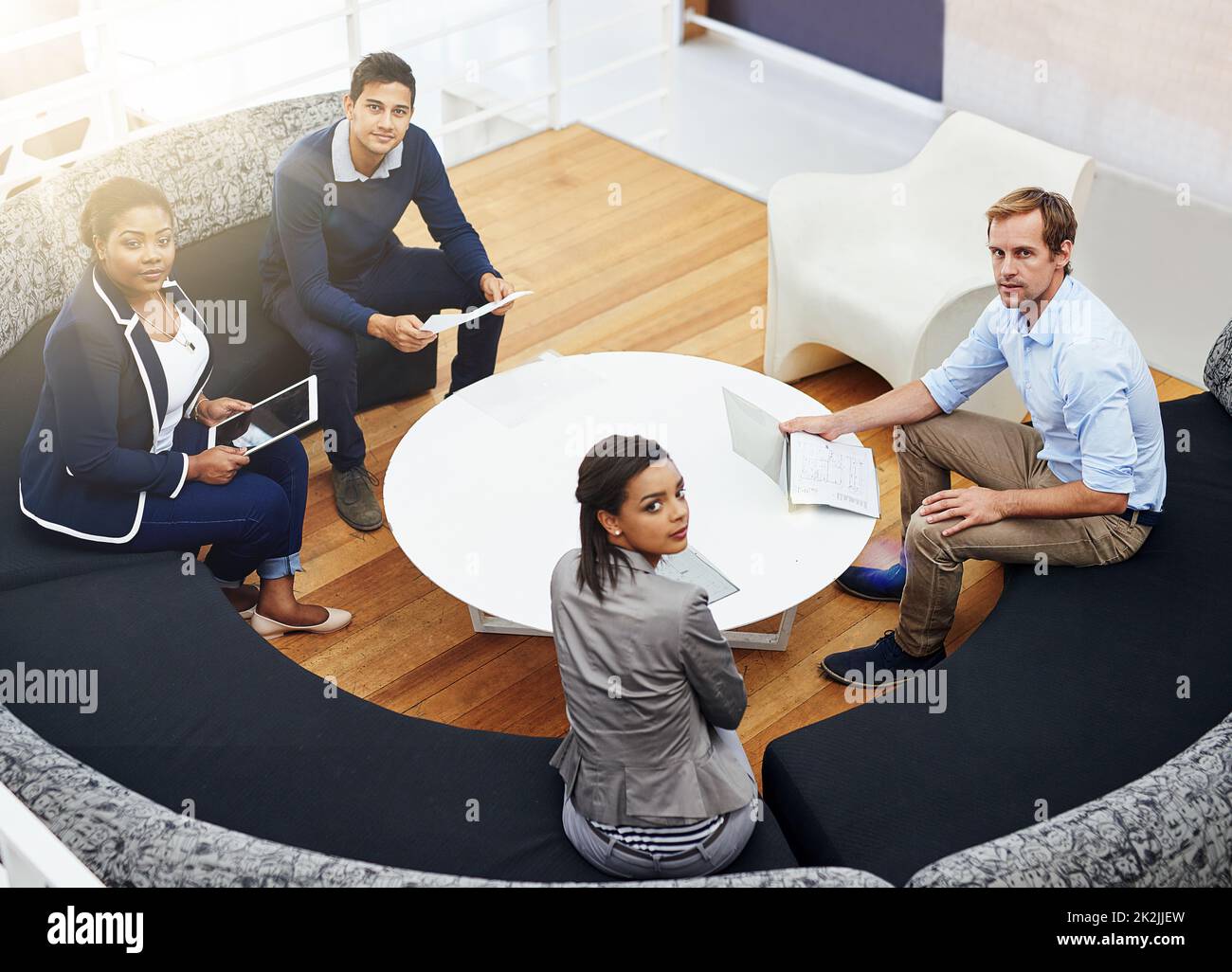 The round table of success. High angle portrait of a group of ...