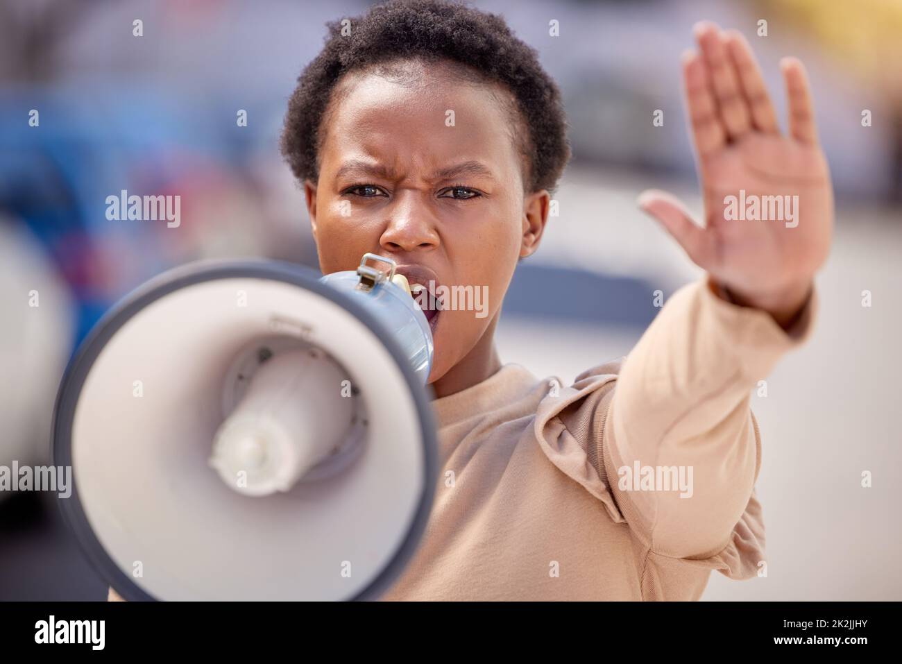 Person speaking megaphone in march hi-res stock photography and images ...