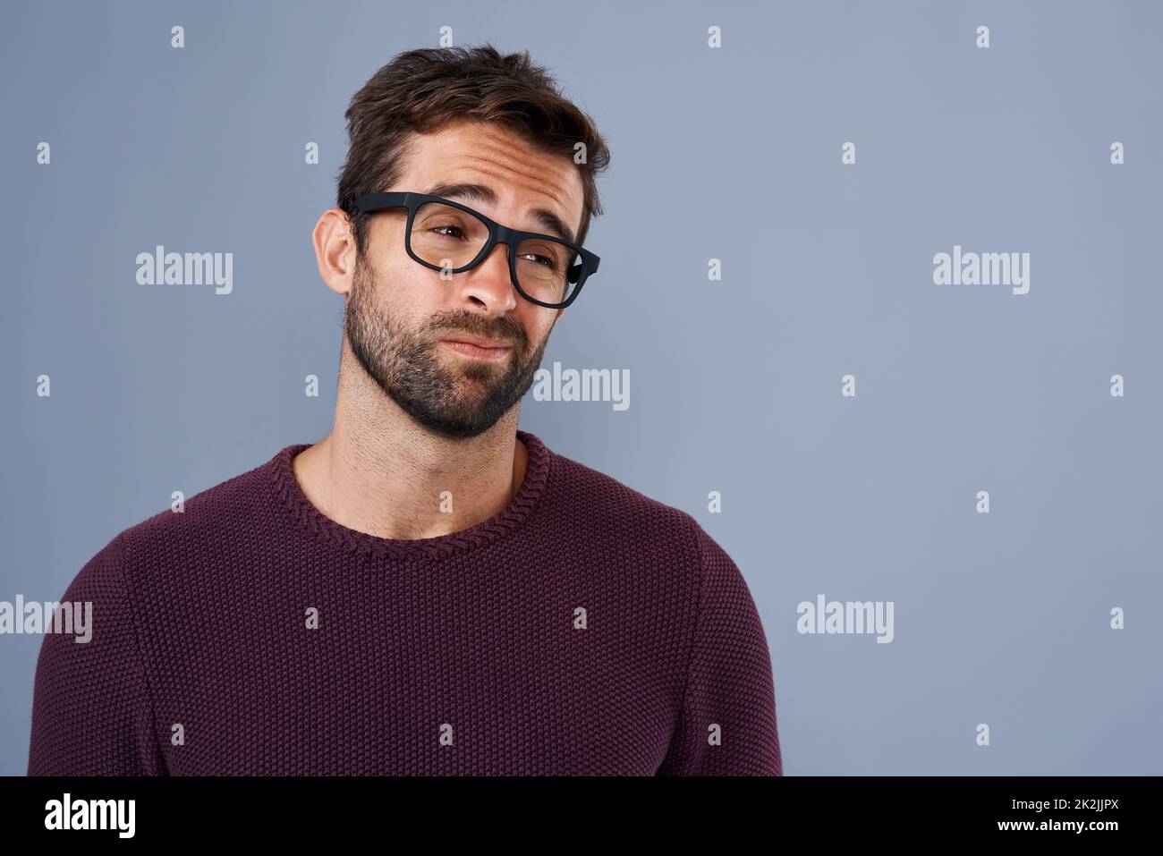 How bout no. Studio shot of a handsome young man looking doubtful ...